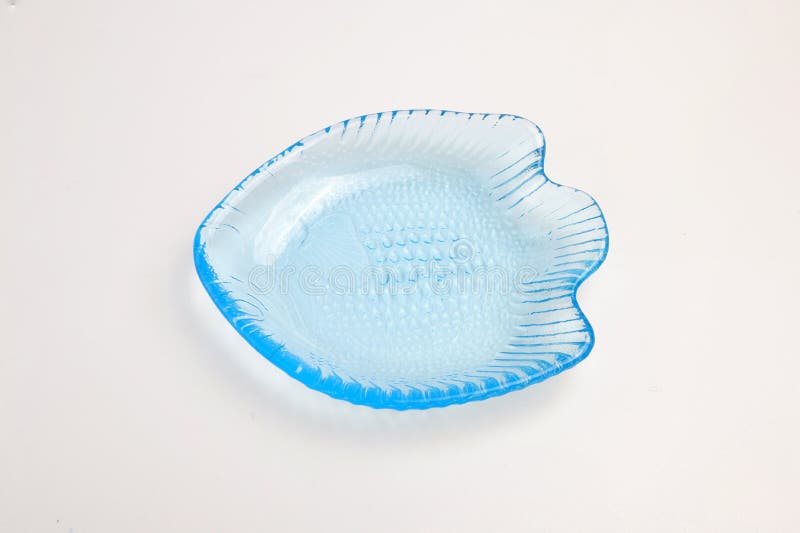 Transparent Blue Glass Cup, Fish Shaped on a White Background Stock ...