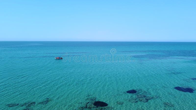 Transparent Blue Open Sea with Sailboat. Aerial View Stock Footage ...