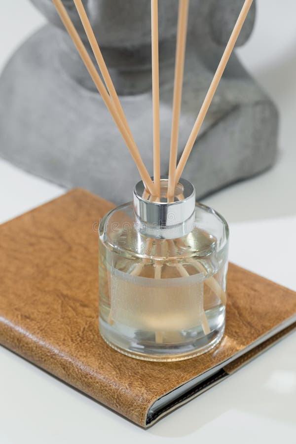 Transparent Bottle of Aroma Diffuser on a Light Grey Background. Stock ...