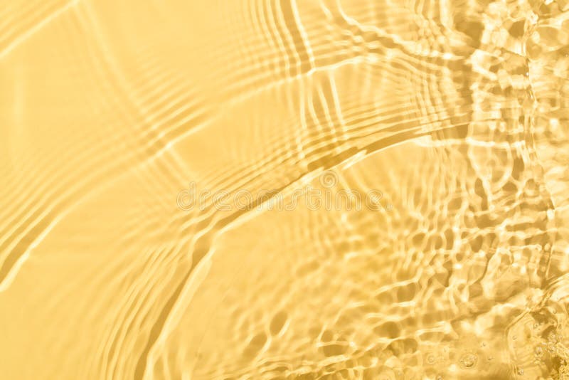Transparent and Clean Yellow Water Background with Sunlight Reflection ...