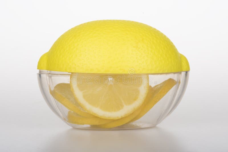 Transparent Container for Lemon and a Sliced Lemon Inside Stock Photo ...