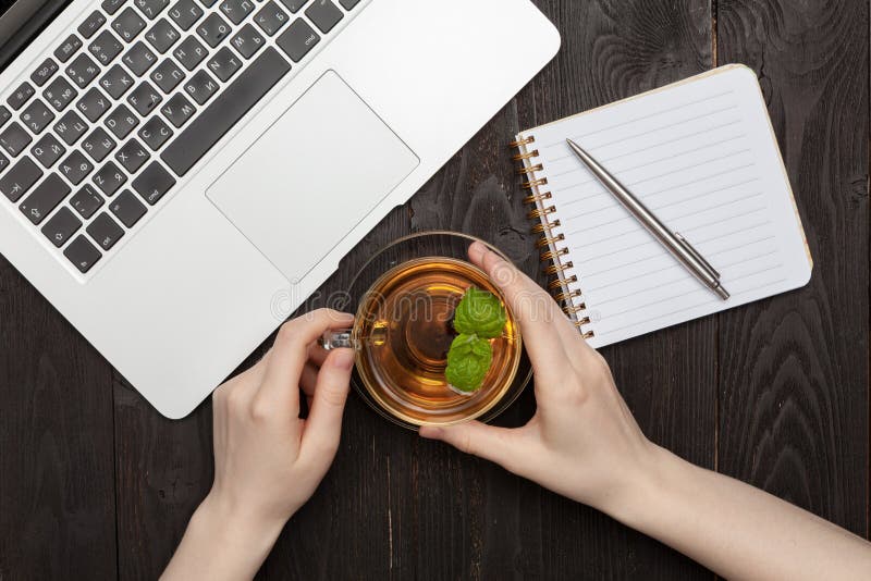 Transparent Cup of Amber-colored Black Tea in Female Hands Stock Image ...