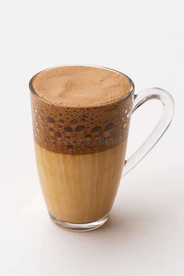 A Transparent Cup with Brown Coffee Stands on a White Table Stock Photo ...