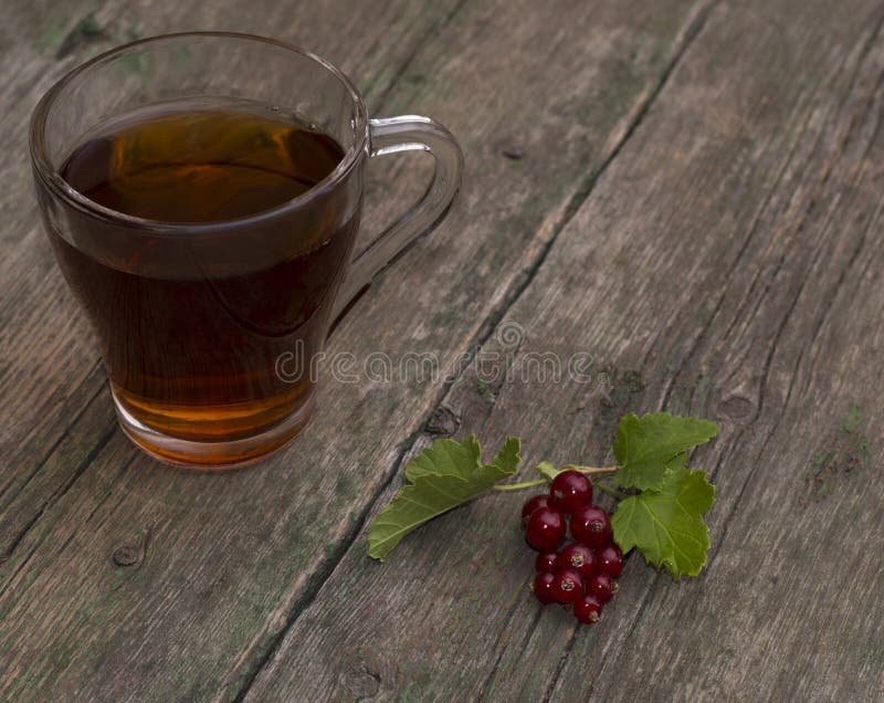 The Transparent Cup of Tea and Currant on the Shabby Desktop Stock ...
