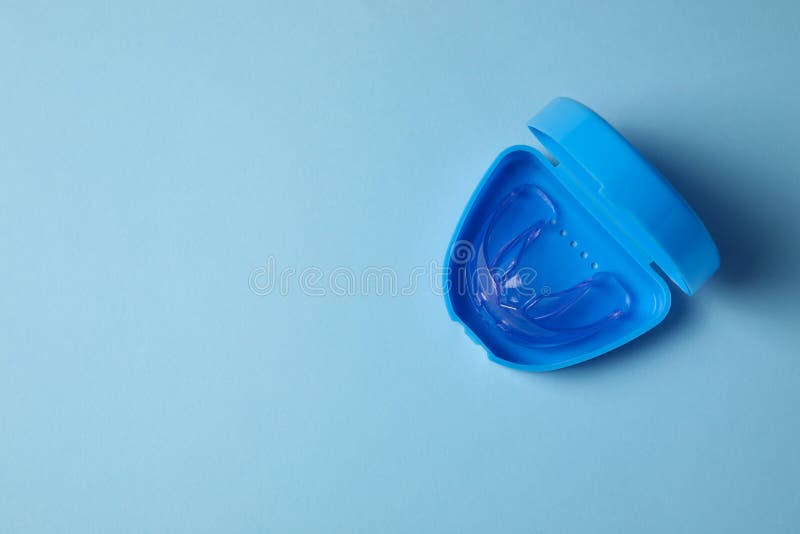 Transparent Dental Mouth Guard in Container on Light Blue Background ...