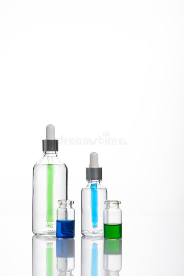 Transparent Dropper Bottle with White Bottom and Colored Dropper Stock ...
