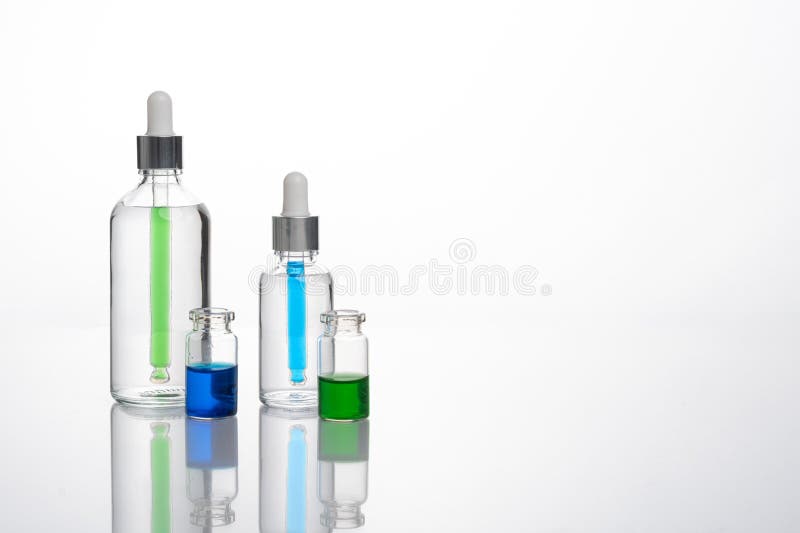 Transparent Dropper Bottle with White Bottom and Colored Dropper Stock ...