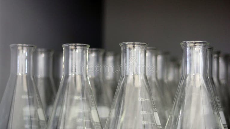 Transparent Erlenmeyer Flasks or Conical Flasks on Shelf in Science ...