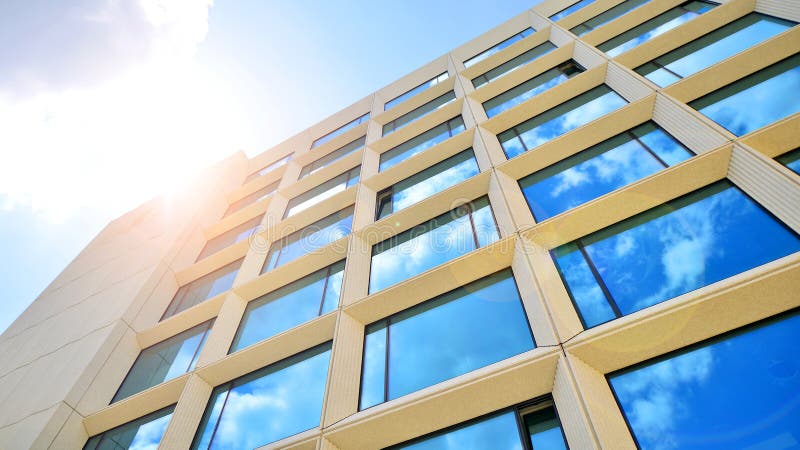 Modern Office Building with Glass Facade on a Clear Sky Background ...