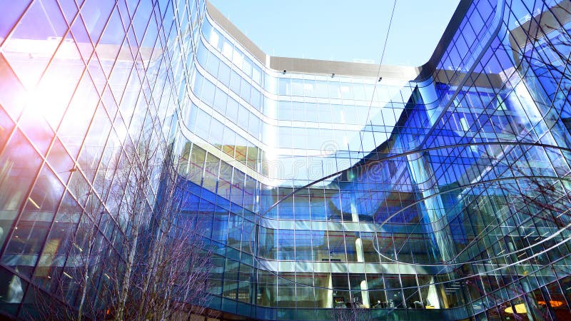 Modern Office Building with Glass Facade on a Clear Sky Background ...