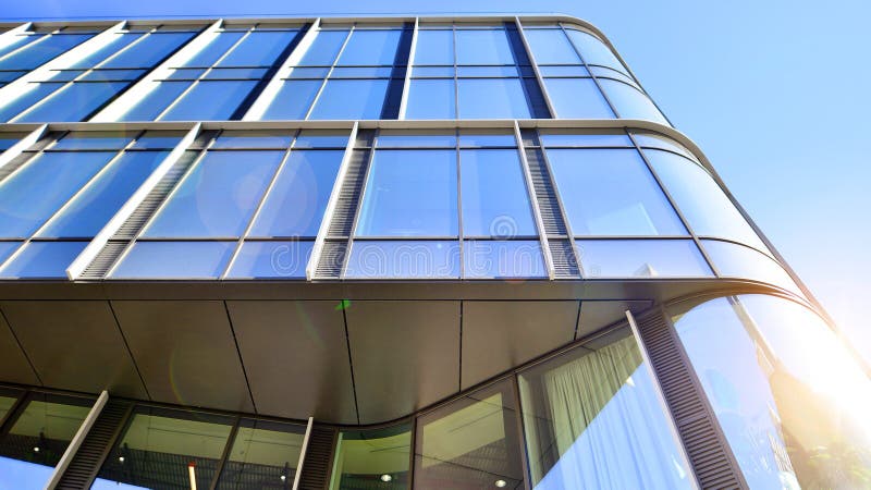 Modern Office Building with Glass Facade on a Clear Sky Background ...