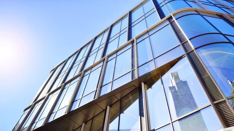 Modern Office Building with Glass Facade on a Clear Sky Background ...