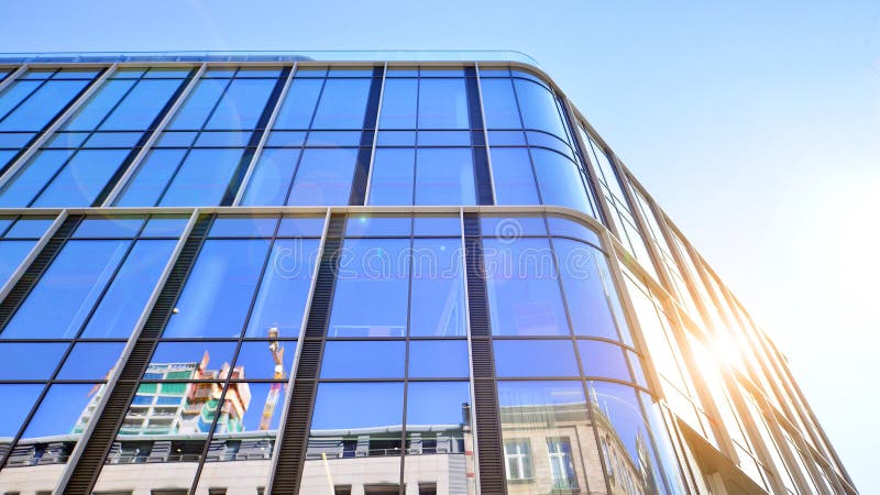 Modern Office Building with Glass Facade on a Clear Sky Background ...