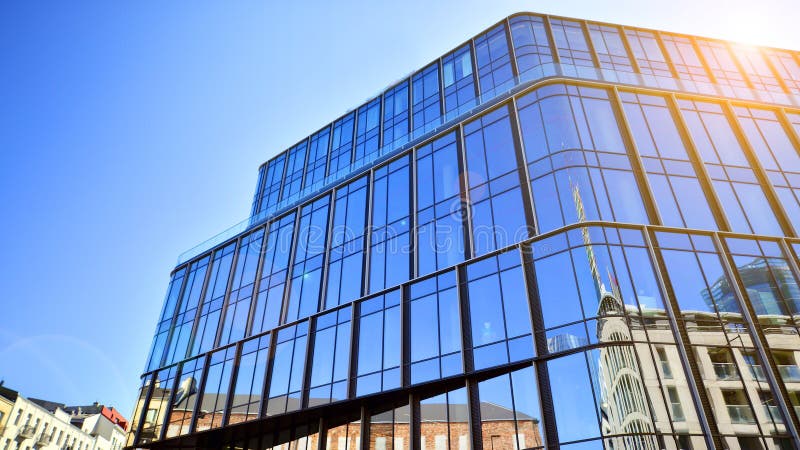 Modern Office Building with Glass Facade on a Clear Sky Background ...