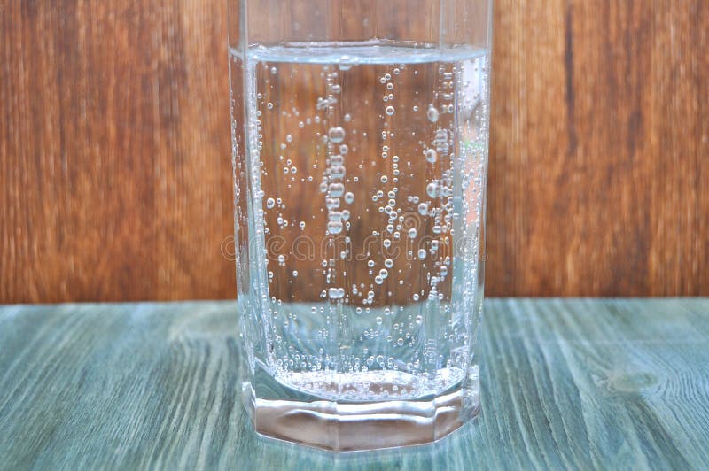 Transparent Glass of Water with Bubbles on the Table Stock Image ...