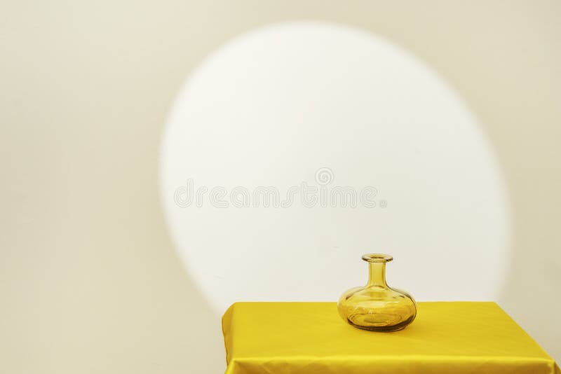 Transparent Gold Colored Decorative Glass Jar on a Yellow Cloth Stock ...