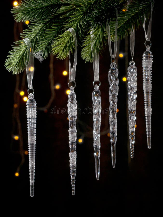 Transparent Icicles on a Black Background Hang on a New Year S Branch ...