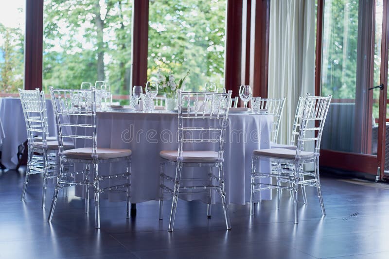 Transparent Light Chairs at the Banquet.Specific. Weightless ...