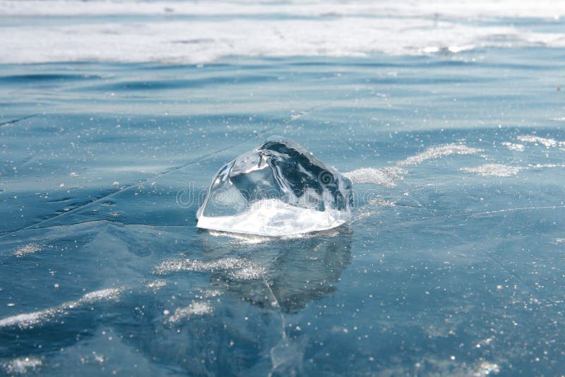 A Transparent Piece of Ice Lies on the Blue Ice Stock Photo - Image of ...