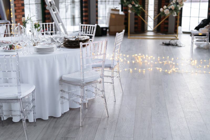 Transparent Plastic Chairs for Wedding Guests. Modern Loft Space, Large ...