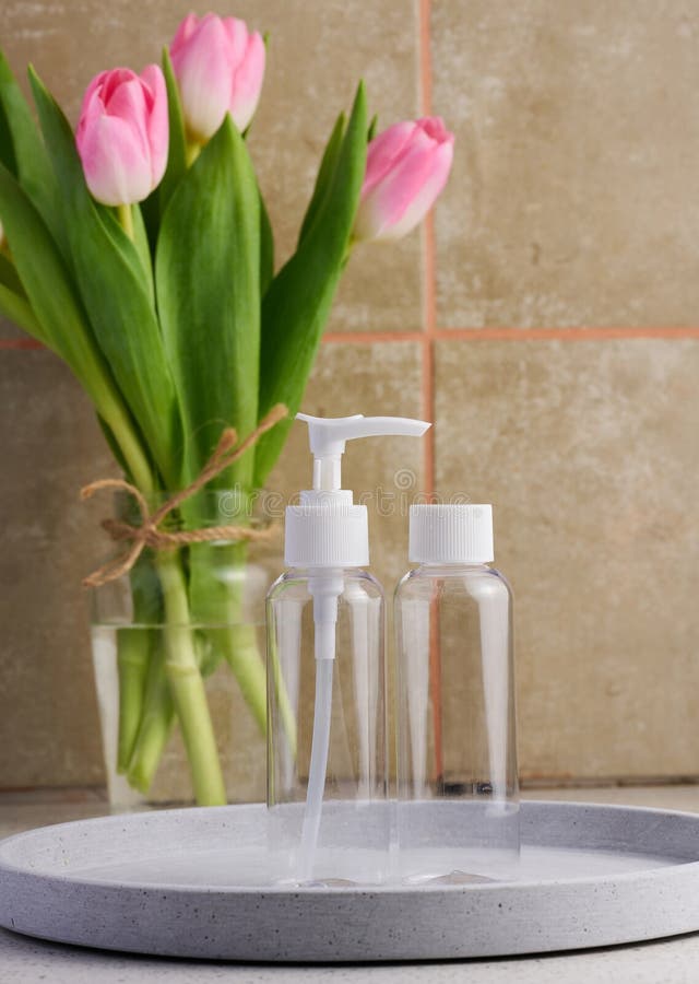 Transparent Plastic Container with a Dispenser on the Table. Bottle for ...