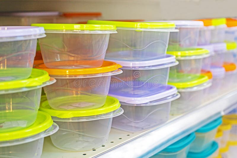 Transparent Plastic Containers with Colorful Lids on the Store Counter ...