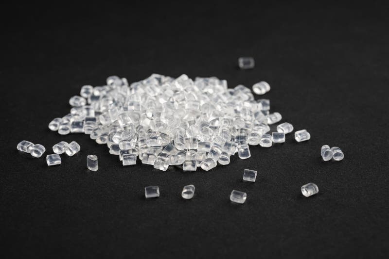 Transparent Plastic Granules on Black Background.close-up. Polymer ...