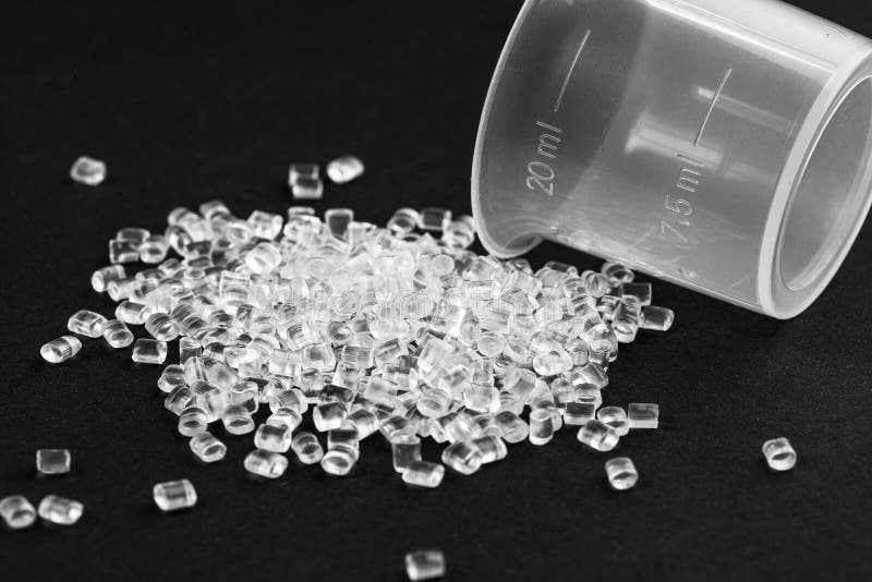 Transparent Plastic in Granules on a Black Background. Polymer Pellets ...
