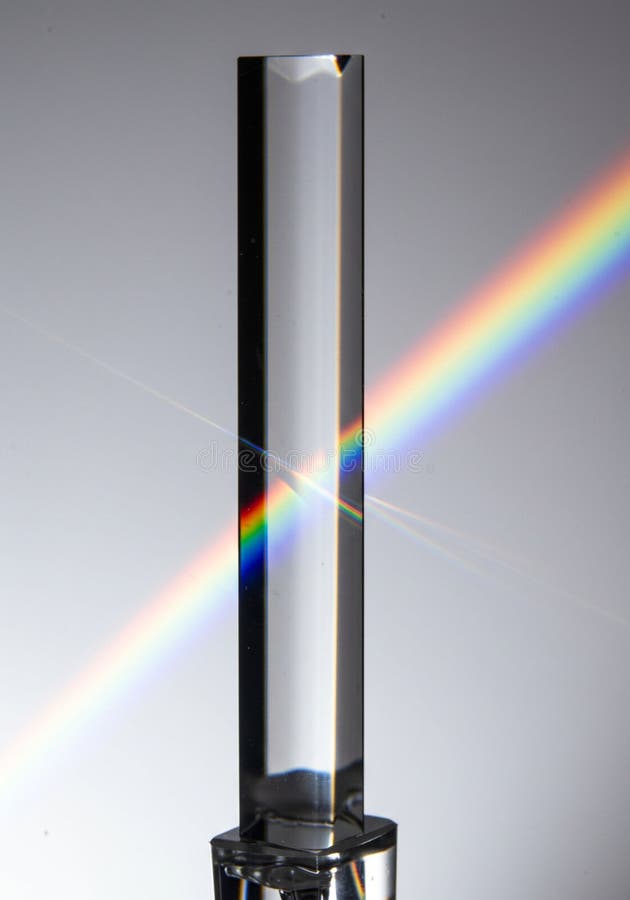 A Transparent Prism Refracts Light, Creating a Vivid Spectrum of Colors ...