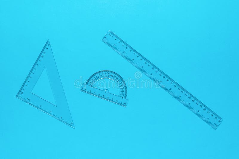 Transparent Ruler, Triangle Protractor on a Blue Background Stock Photo ...