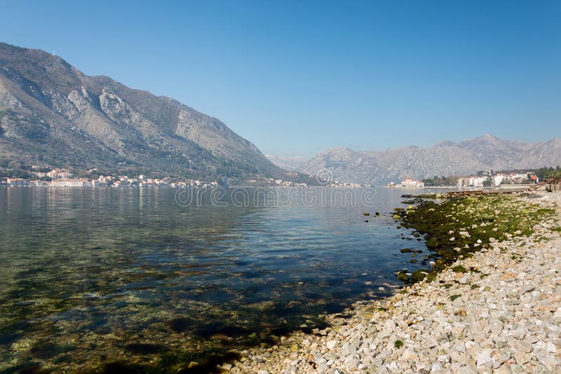 Transparent Sea with Mountains in the Background Stock Image - Image of ...