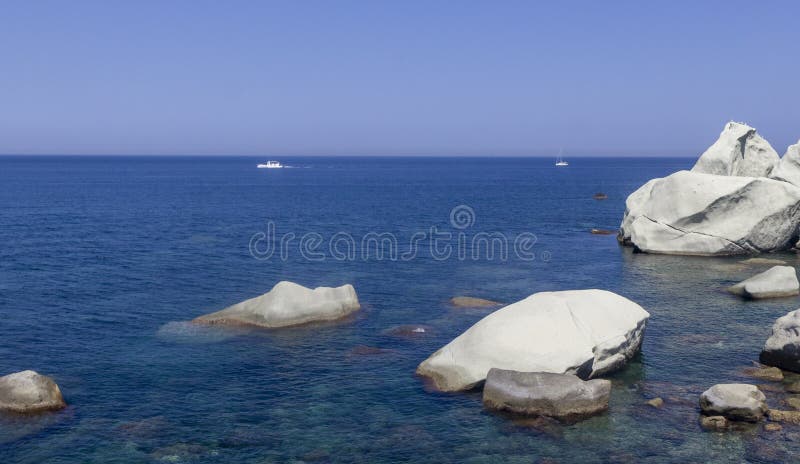 Transparent sea with rocks stock photo. Image of seascape - 179052888