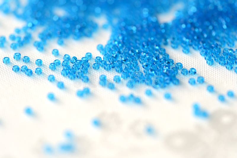 Transparent Seed Beads Blue Color Scattered on a Textile Background ...