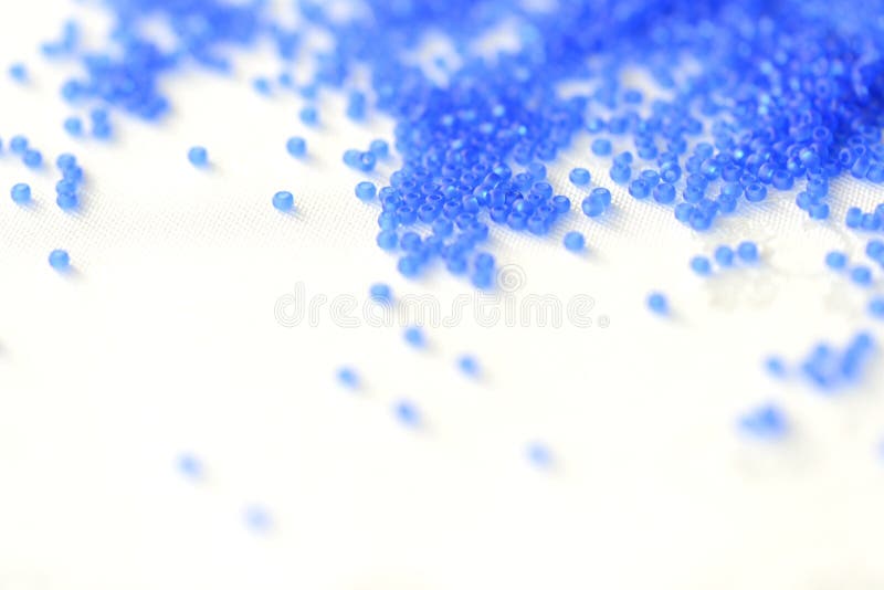 Transparent Seed Beads Dark Blue Color on a Textile Background Stock ...