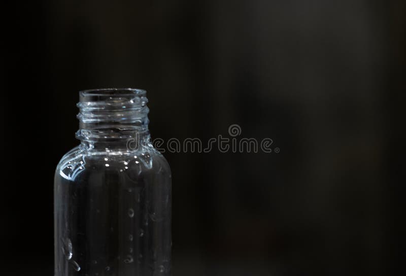 A Small Empty Bottle with Drops of Water Stock Photo - Image of glass ...