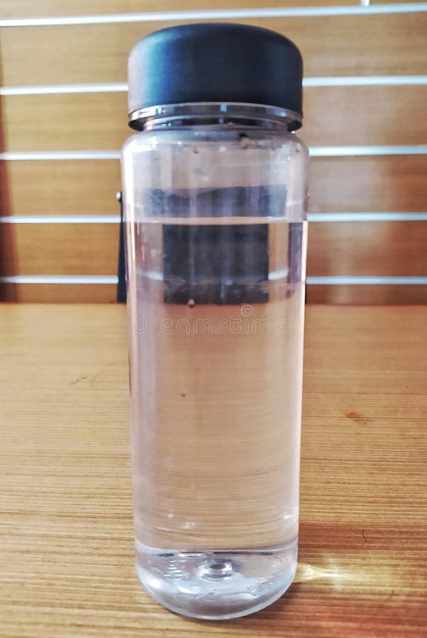 Transparent Water Bottle on the Brown Table Stock Photo - Image of ...