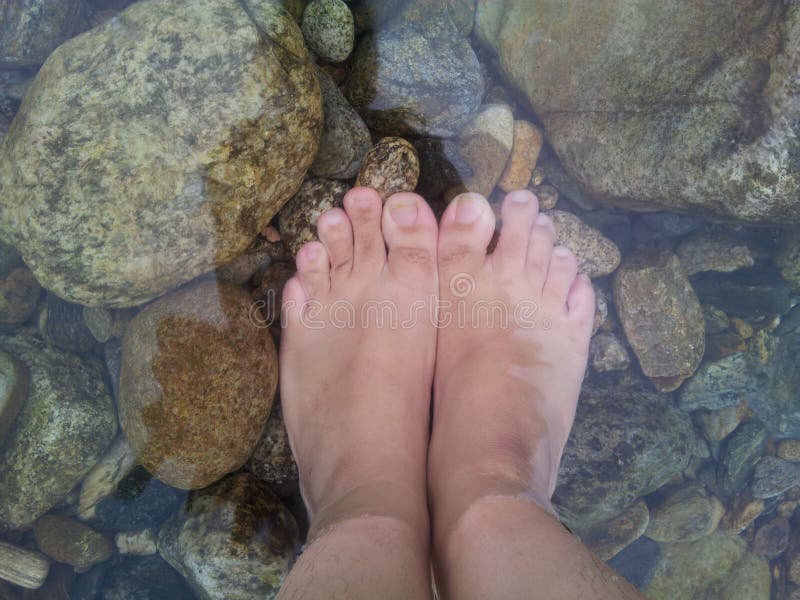 Transparent Water Surface with Human Feet from Top View Stock Photo ...
