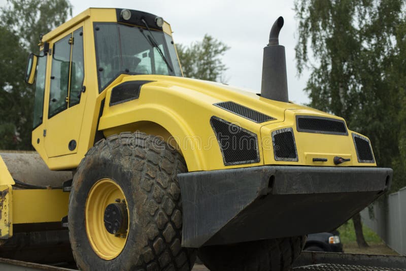 Transportation on Platform of Heavy Machinery. Yellow Tractor Stock ...