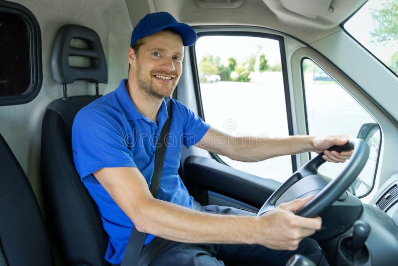 Transportation Services - Young Male Driver in Blue Uniform Driving a ...