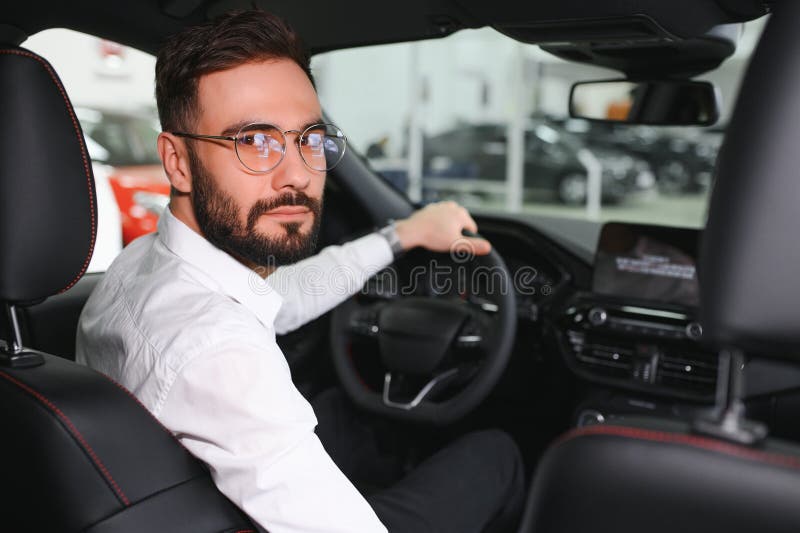 Transportation, Vehicle and People Concept - Male Car Driver Looking at ... Transportation, Vehicle and People Concept - Male Car Driver Looking at ...