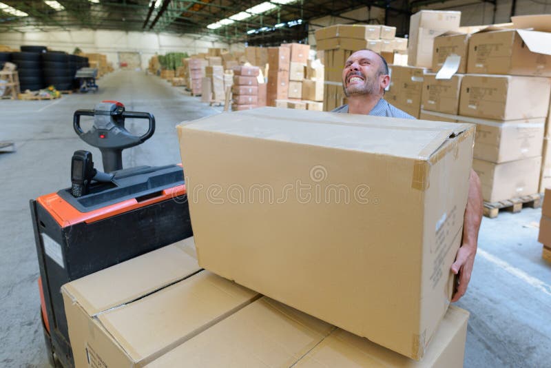 Transportation Worker Delivering Heavy Boxes Stock Image - Image of ...