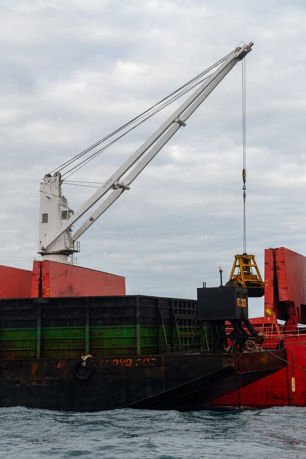 Transporting Coal into Large Ships in the Middle of the Sea Stock Image ...