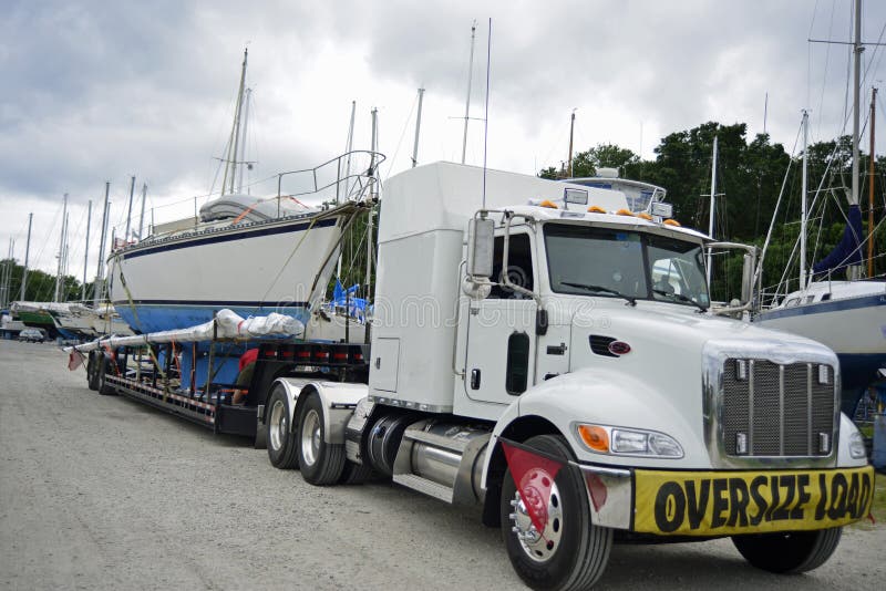 Transporting Large Sailboat on a Flat Bed Stock Photo - Image of sunny ...