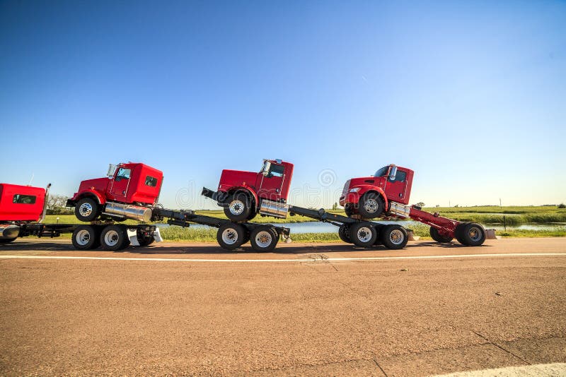 Transporting Three New Red Trucks Stock Image - Image of load, cargo ...