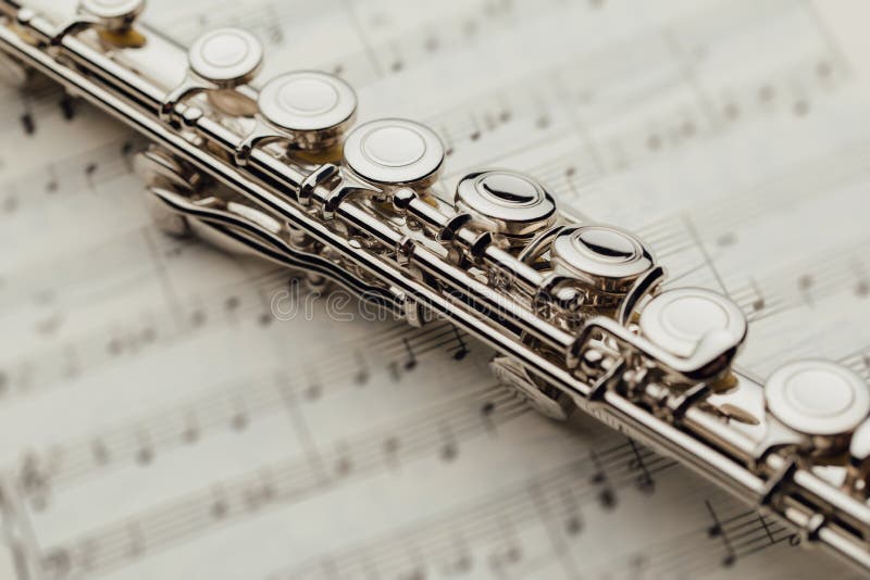 Transverse Flute on Music Sheet Stock Image - Image of arts, backdrop ...