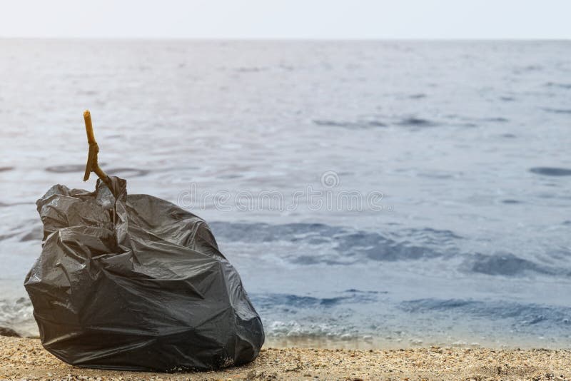 Trash Bag Full of Garbage on Beach. Space for Text Stock Photo - Image ...