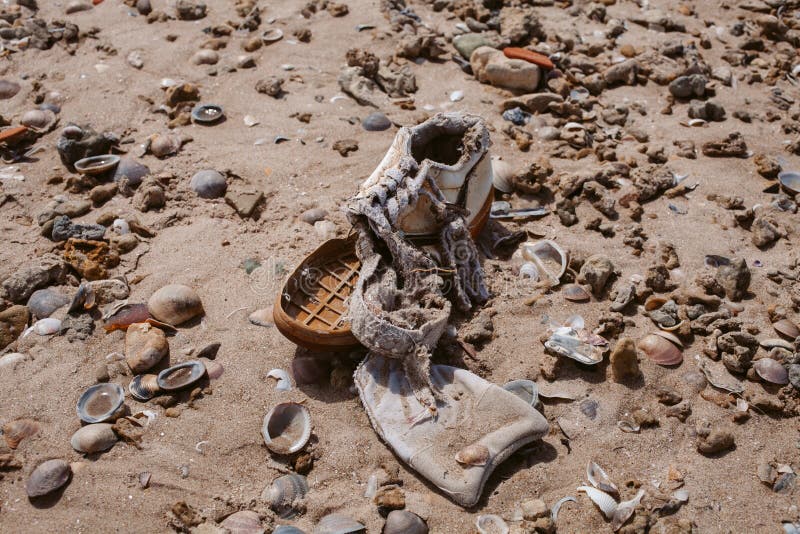 Trash on the Beach. Abandoned Shoe. Garbage and Pollution on the Beach ...