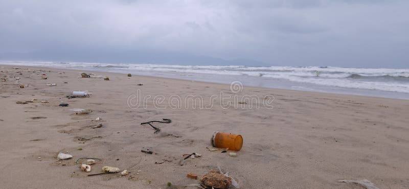 Trash on the Beach of the Sea. Empty Cans and Damaged Products ...