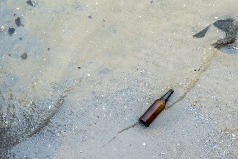 Trash the Beer Bottle on the Beach.Thailand. Stock Image - Image of ...