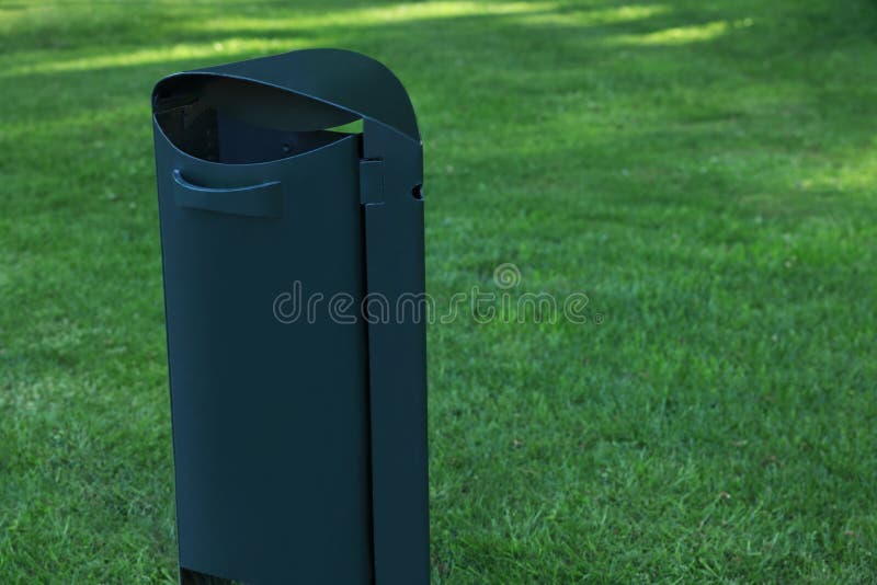 Trash Bin on Green Grass Outdoors. Space for Text Stock Image - Image ...